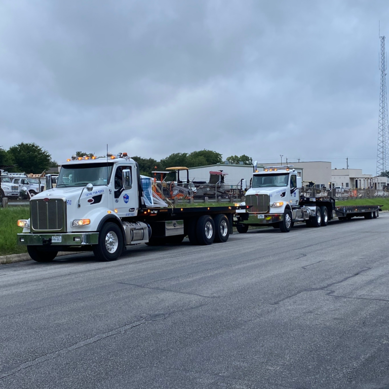 Our Fleet of Heavy Equipment Hauling Trucks | 1st Call